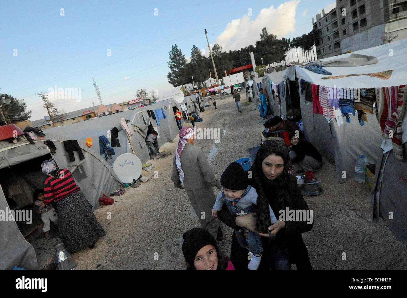 Suruc, Turkey. 15th Dec, 2014. Syrian Kurdish refugees face a difficult ...