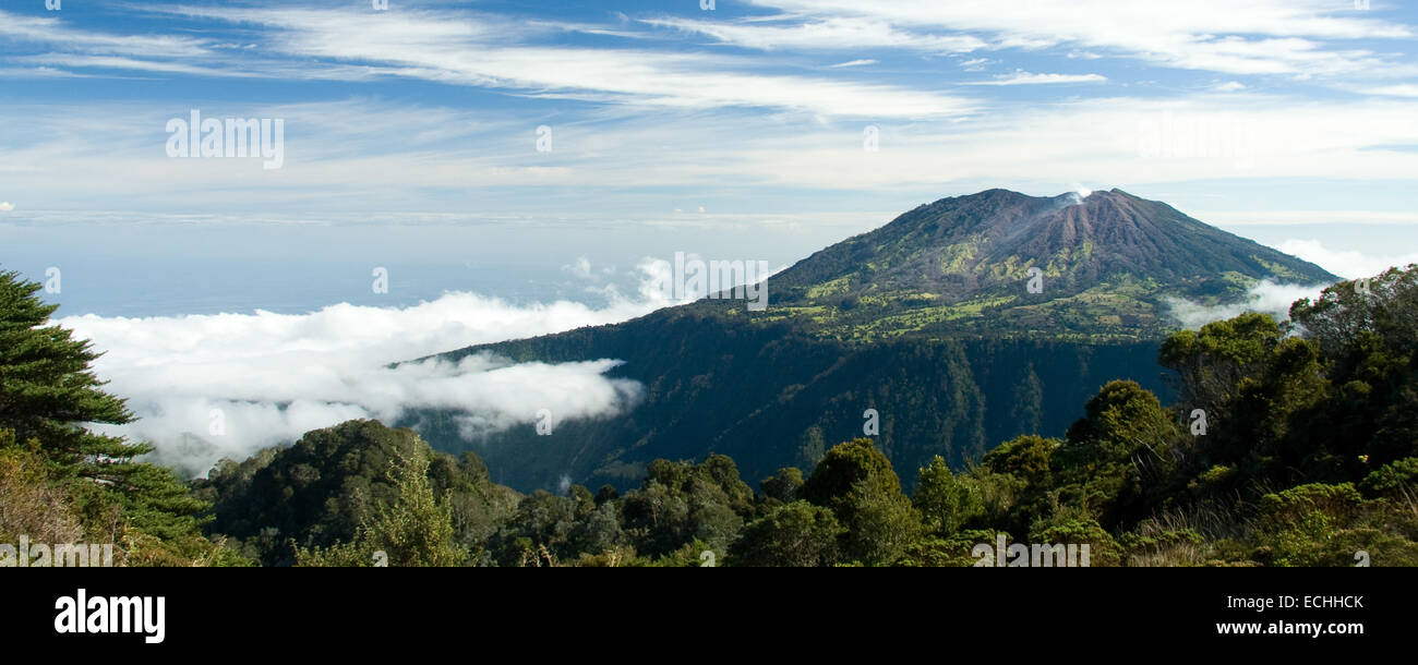 Scenic view of volcano on island of Costa Rica with cloudscape ...
