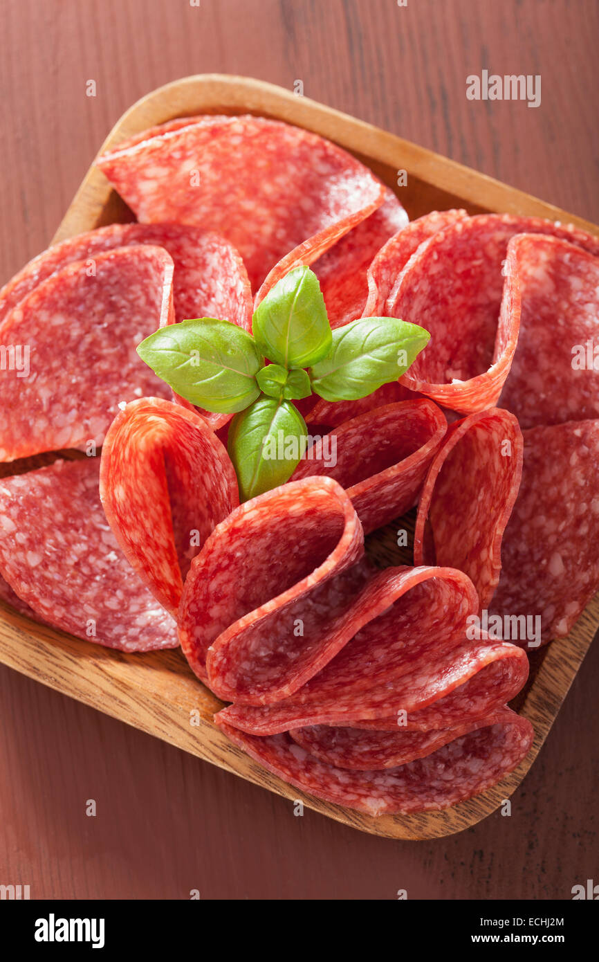 salami slices in wooden plate Stock Photo - Alamy