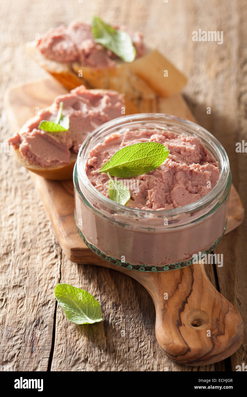 healthy chicken liver pate with sage in jar and on bread Stock Photo ...