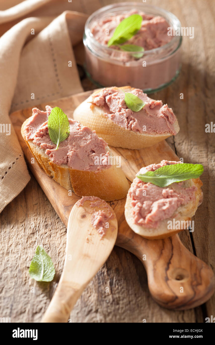 healthy chicken liver pate with sage in jar and on bread Stock Photo ...