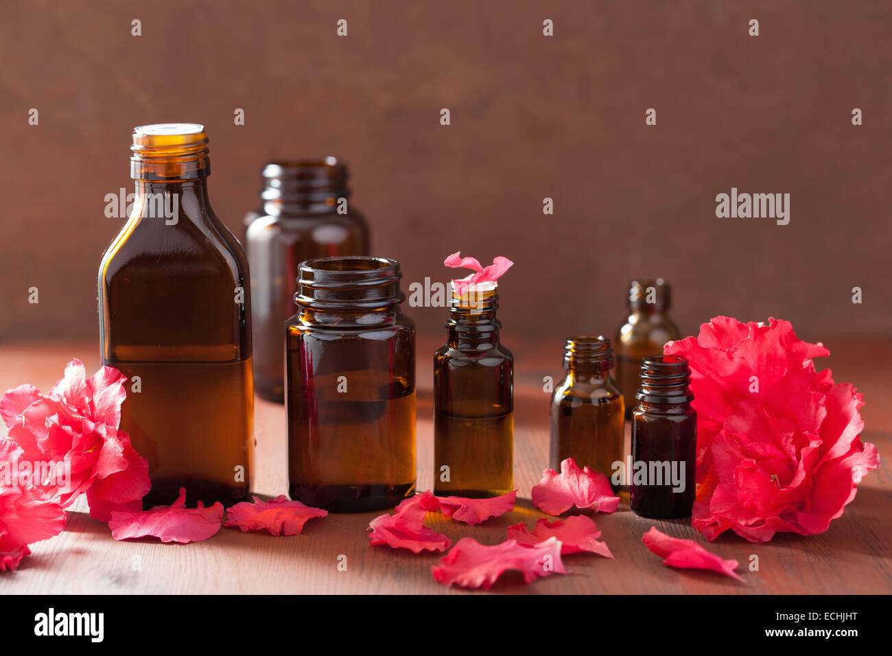 essential oil azalea flowers on dark rustic background Stock Photo - Alamy