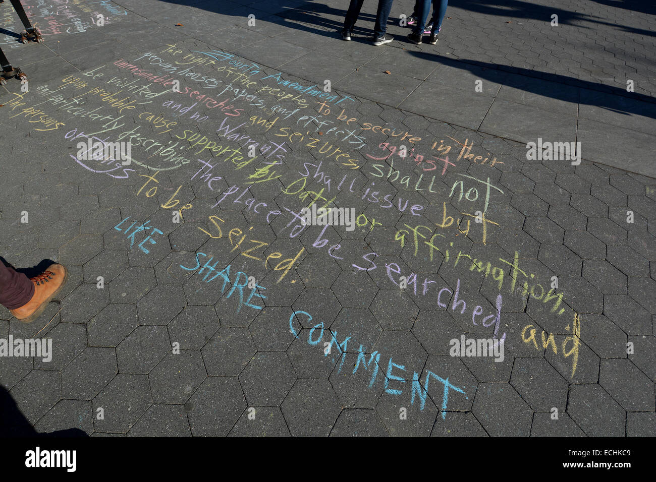New York City, USA. 13th Dec, 2014. Marchers walk around a messaage in ...