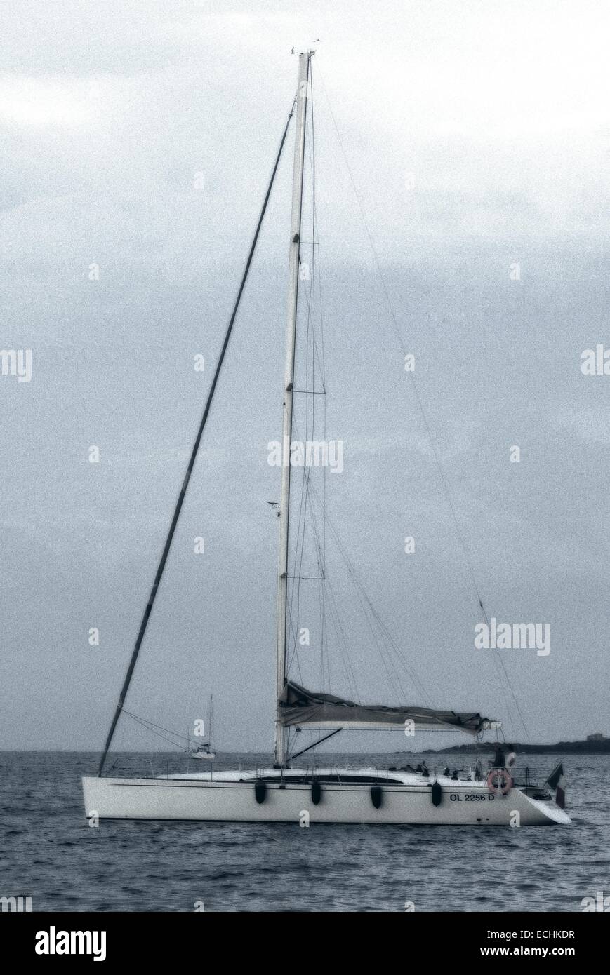 Sailboat in the sea without wind Stock Photo - Alamy