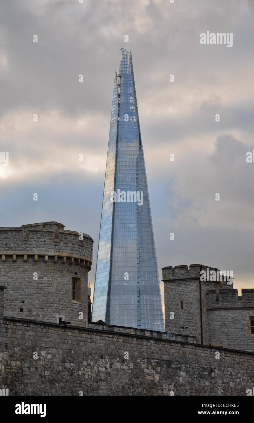 The top of the shard seen behind the walls of the tower of London Stock ...