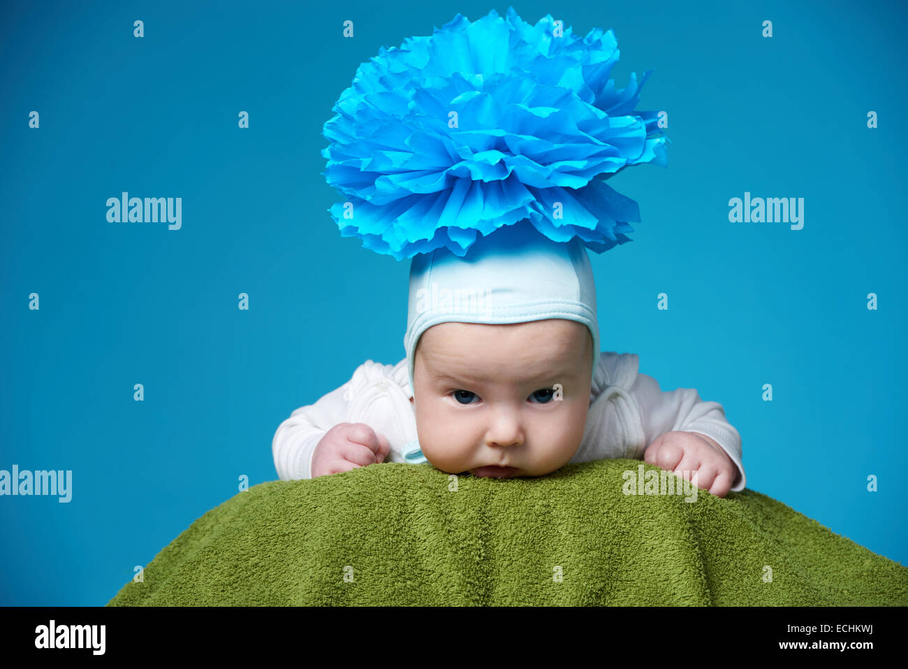 baby portrait with blue flower on head Stock Photo - Alamy