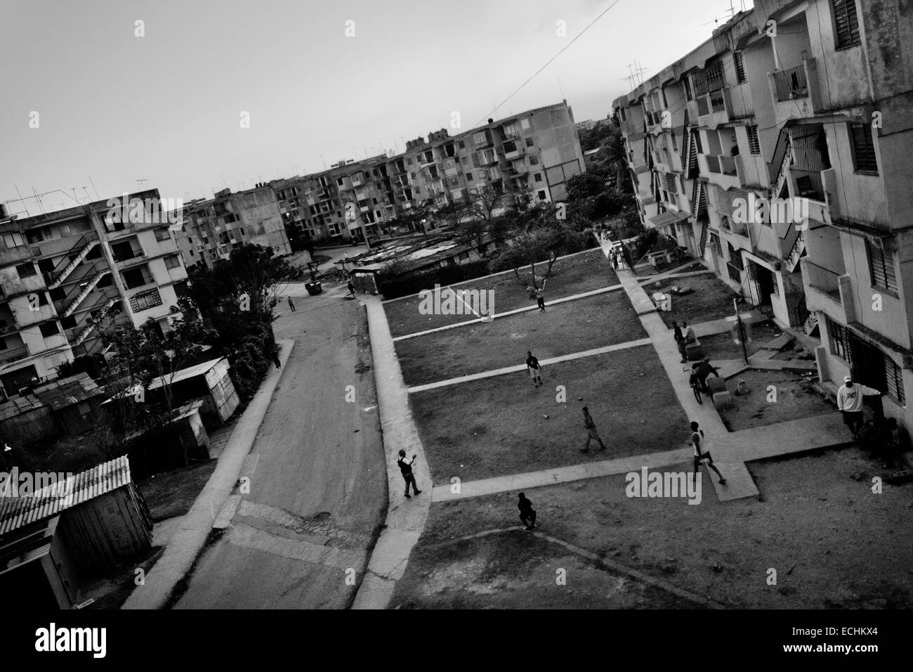 Cuban people hang out in front of the large apartment blocks in Alamar ...