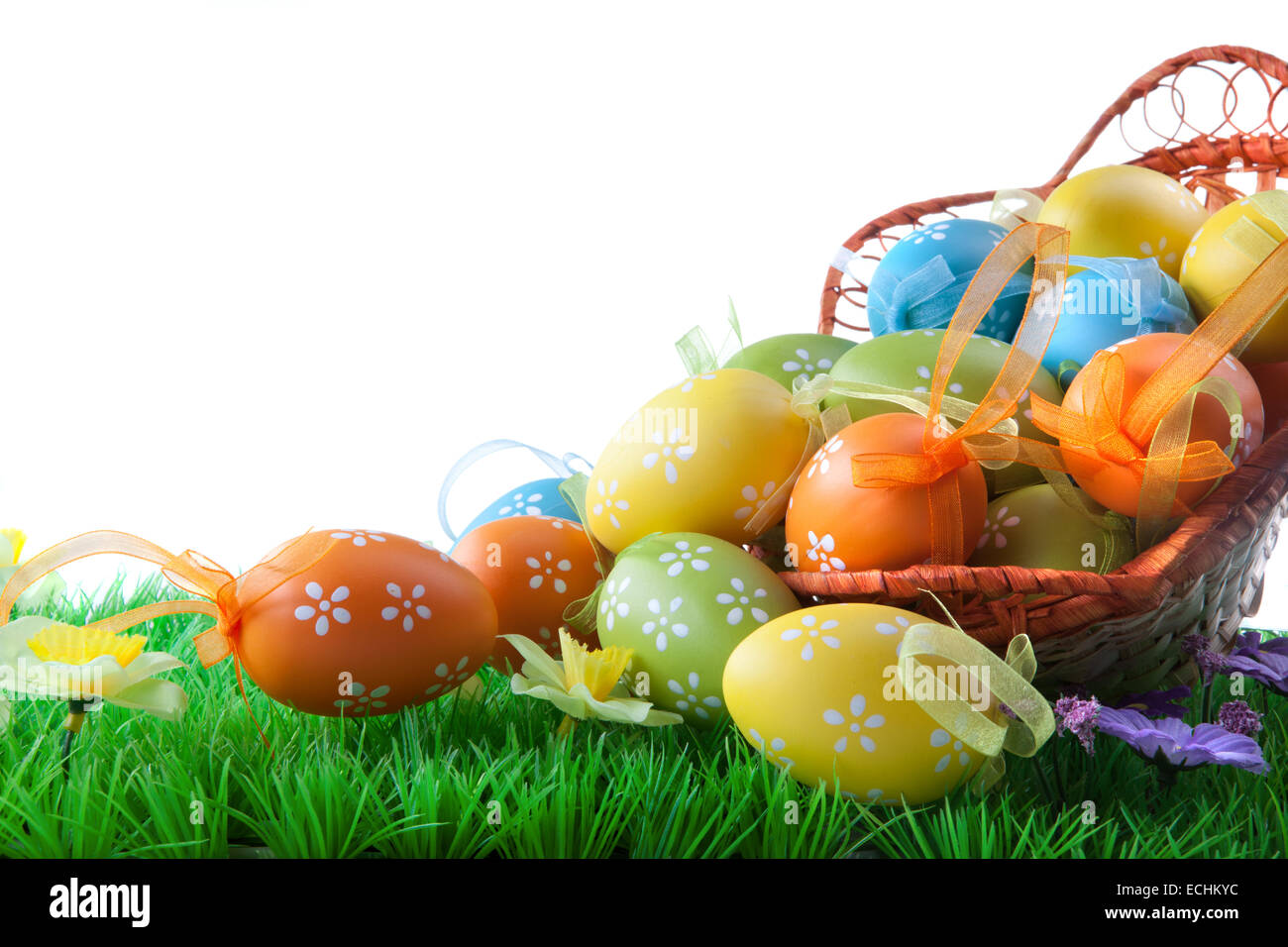 color easter eggs in basket isolated on white Stock Photo - Alamy