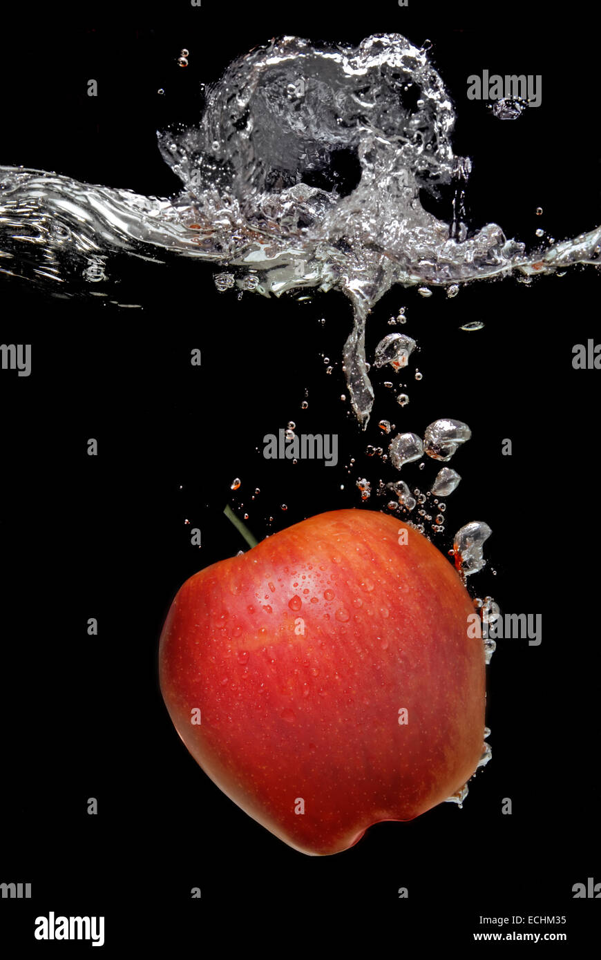 green apple dropped into water with splash isolated on black Stock ...