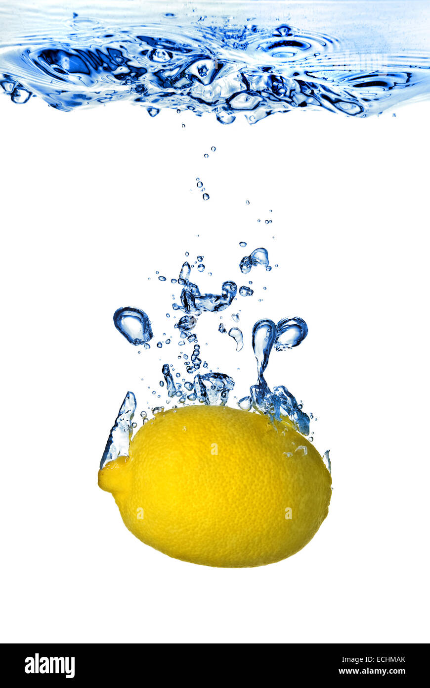 Fresh lemon dropped into water with bubbles isolated on white Stock ...