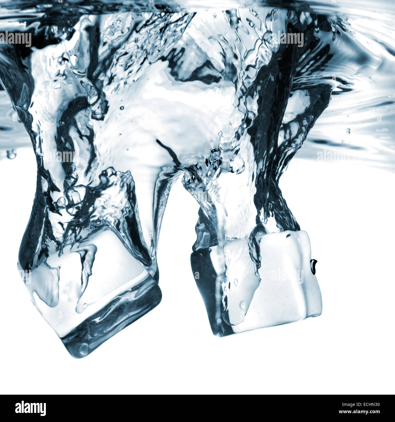 ice cubes dropped into water with splash isolated on white Stock Photo ...