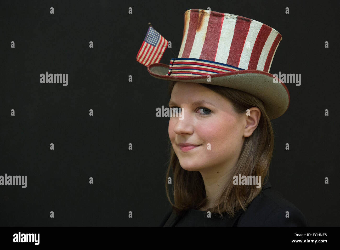 London, UK. 12 December 2014. A Christie's employee poses with a the ...