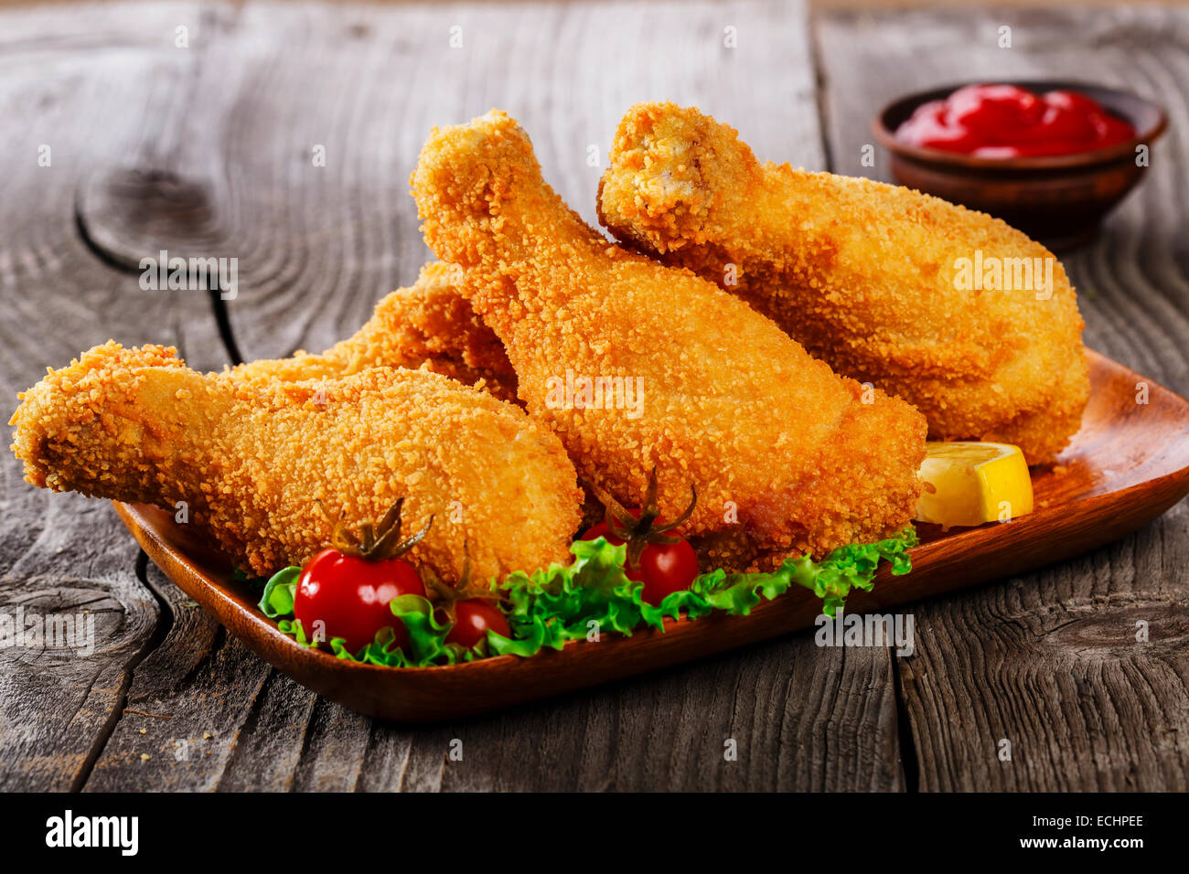 fried chicken legs breaded Stock Photo - Alamy