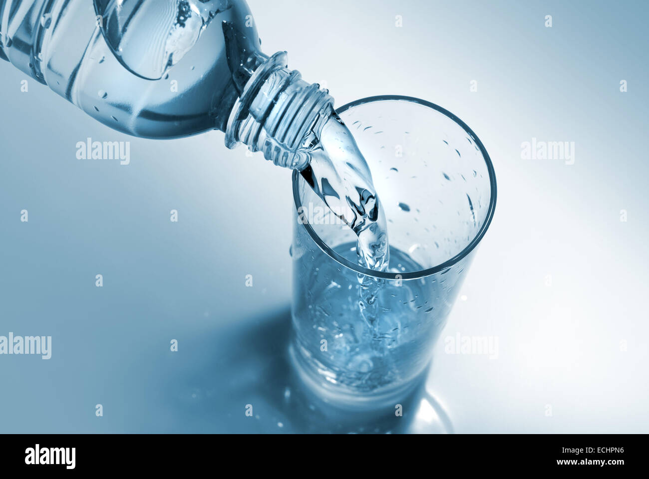 water pouring into glass from bottle Stock Photo - Alamy