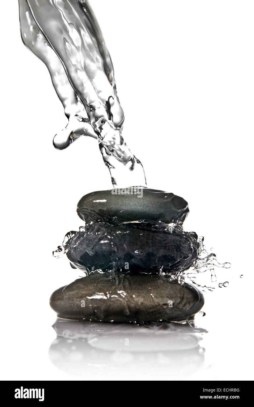 Spa stones with water splash isolated on white Stock Photo - Alamy