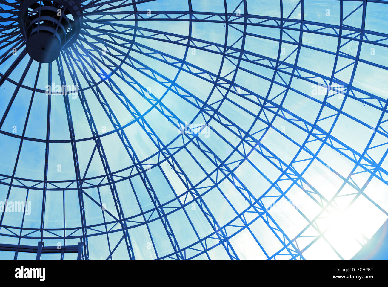 Modern glass roof with blue sky and sun Stock Photo - Alamy