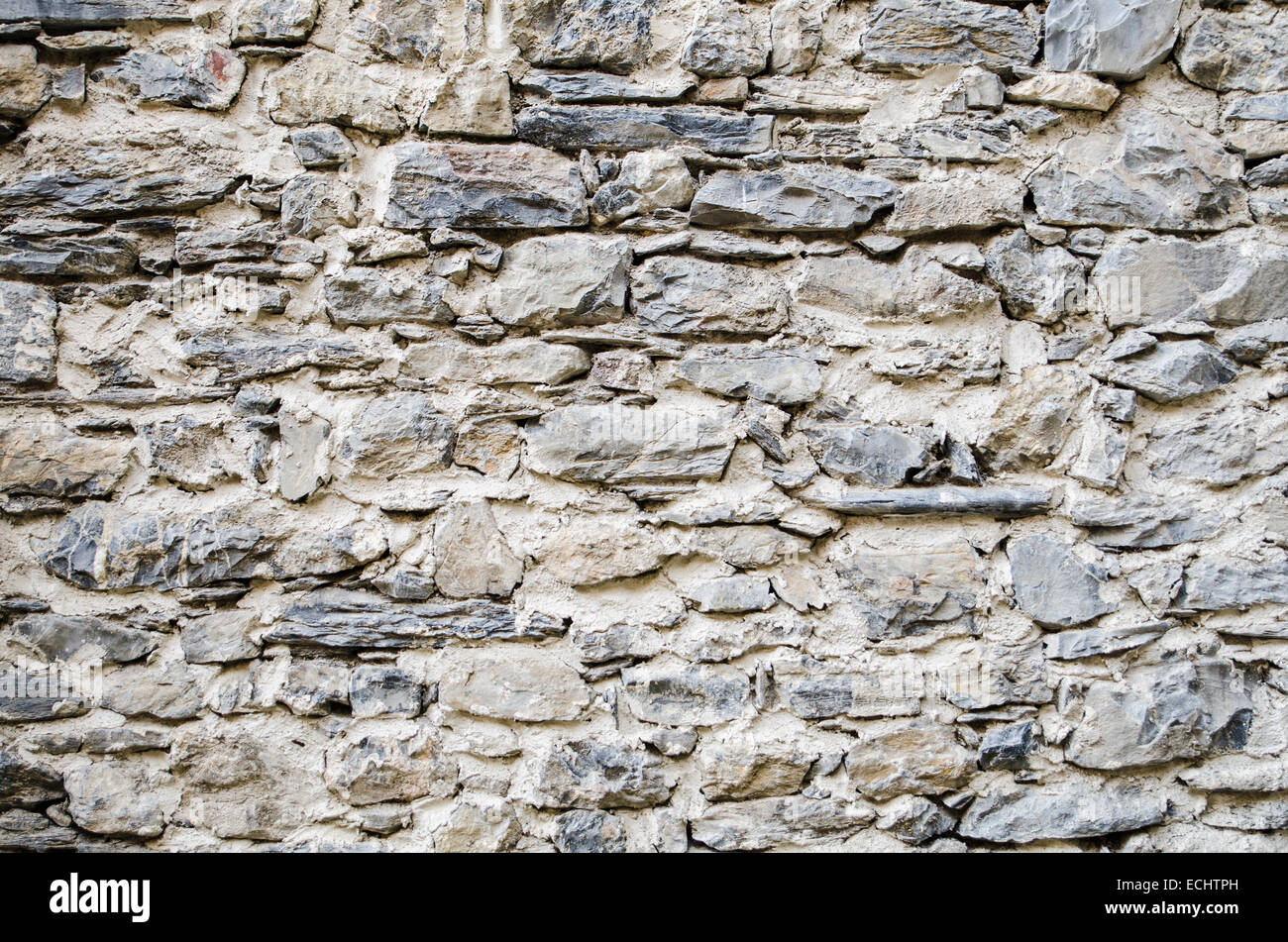 Ancient stone wall in a castle in italy Stock Photo - Alamy