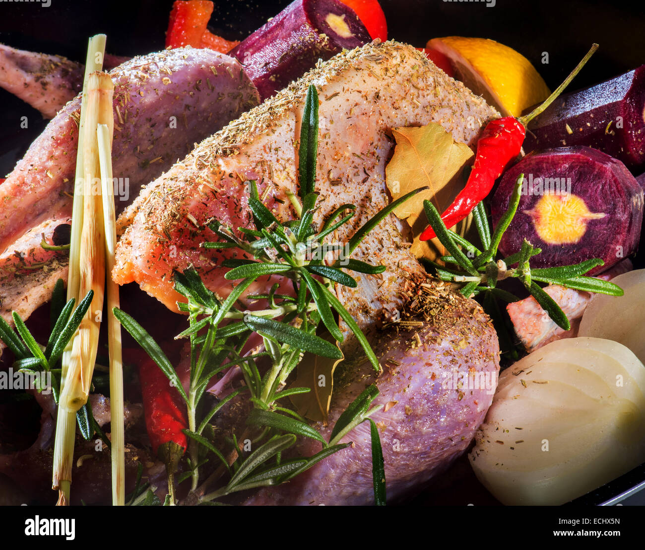 Guinea fowl preparing vegetables for roasting pan. health healthy food ...