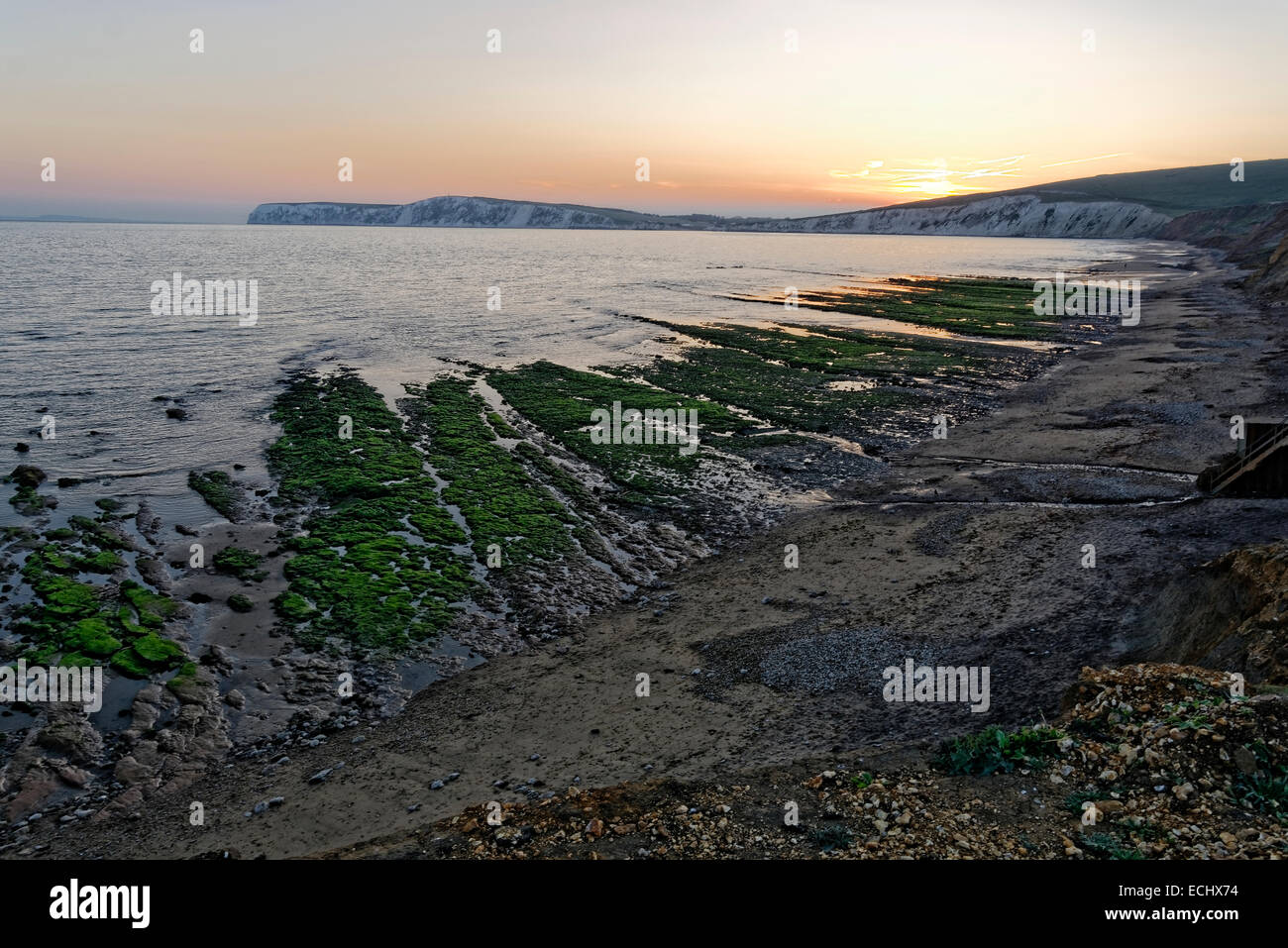 The sun is sinking over Tennyson Down, a backdrop to the beach at ...