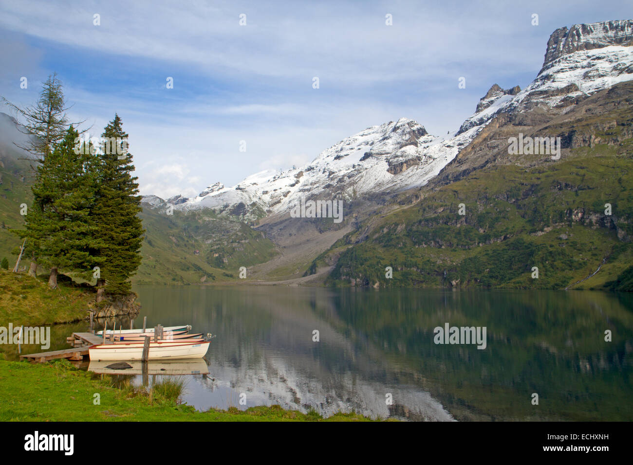 Boats on Engstlensee, a high Alpine lake below Jochpass and Titlis ...