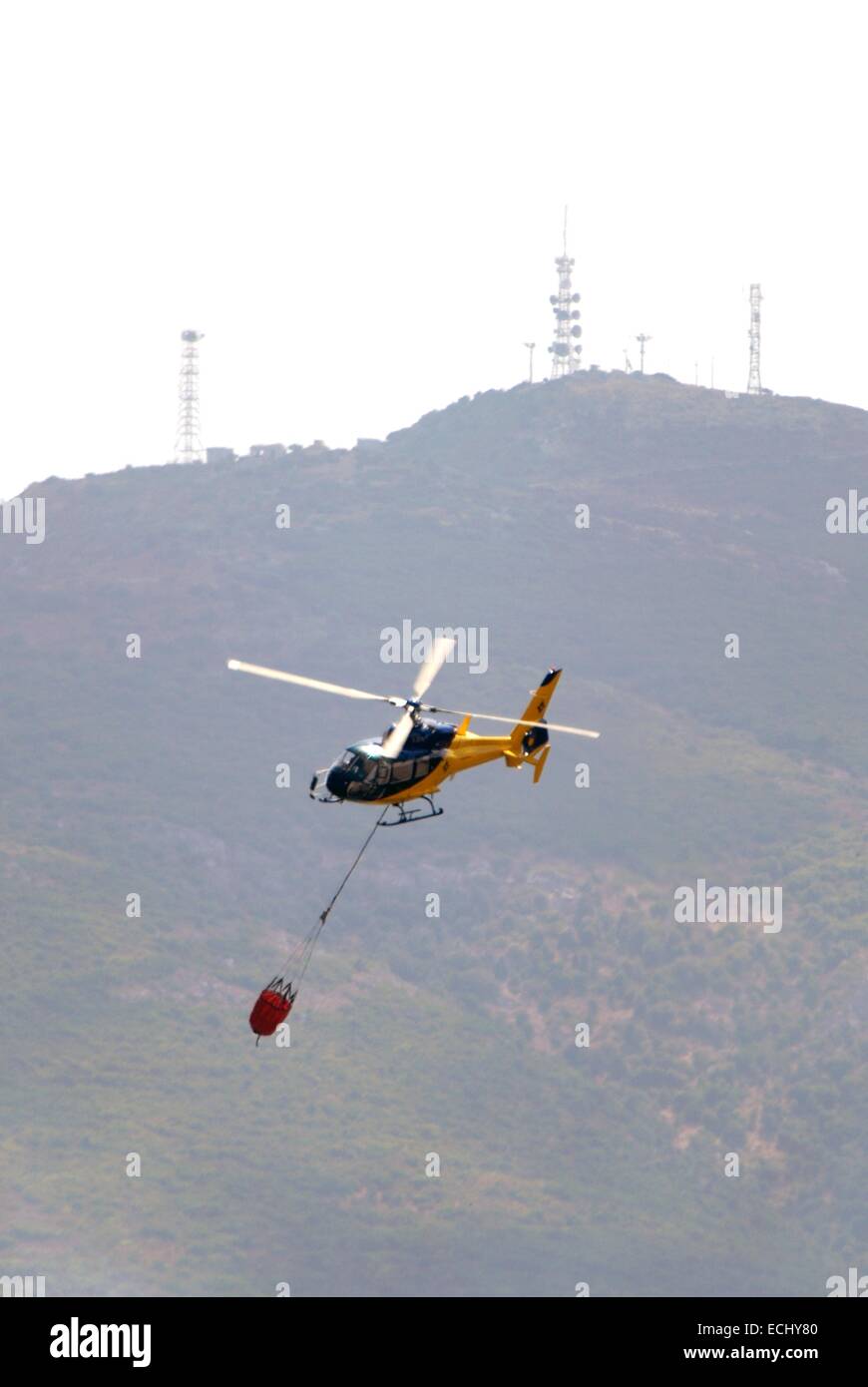 Firefighting helicopter extinguishing fire Stock Photo - Alamy