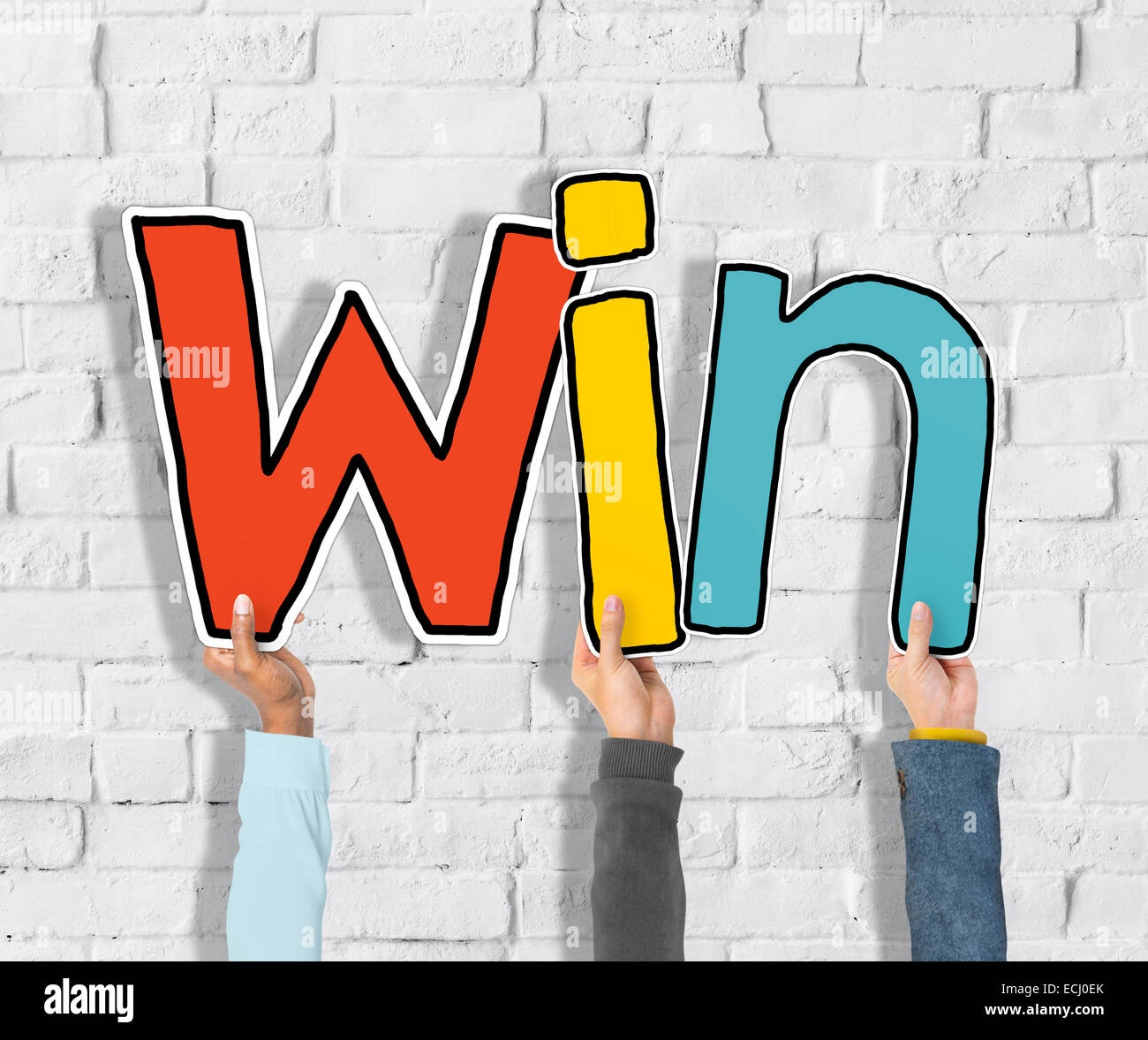 Group of Hands Holding Word Win Stock Photo - Alamy
