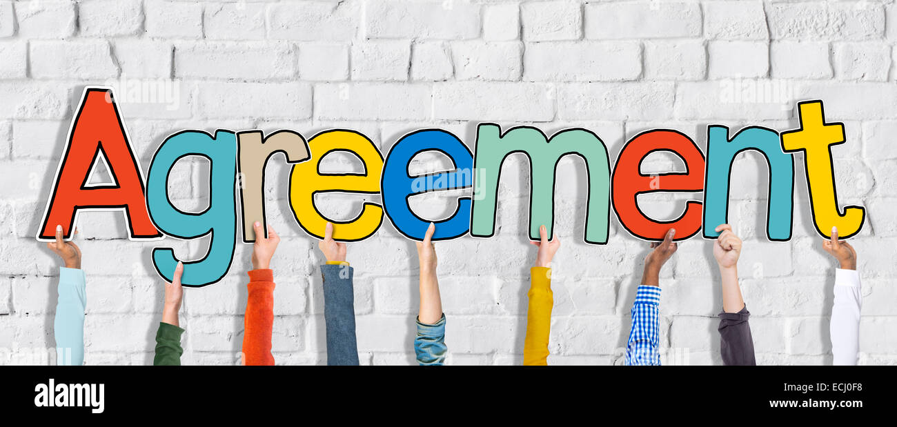 Group of Hands Holding Word Agreement Stock Photo - Alamy