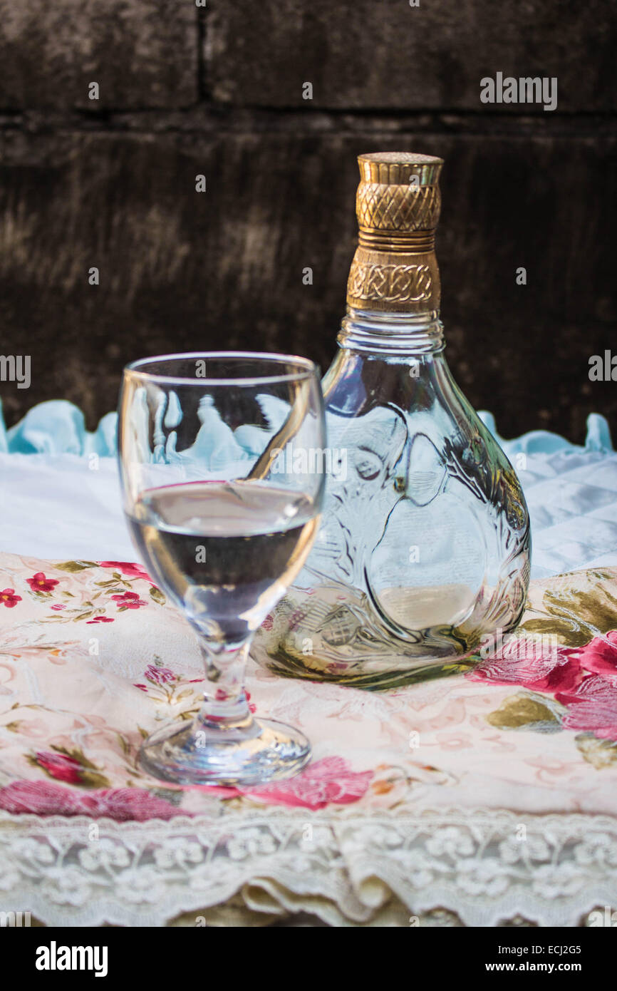 Glass and beverage bottles on table Stock Photo - Alamy