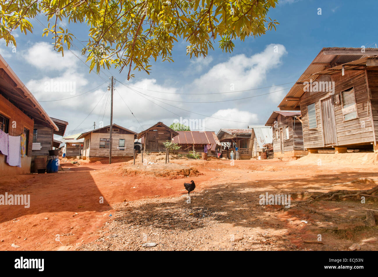 Typical maroon village with wooden homes and sandy streets, Lebi Doti ...