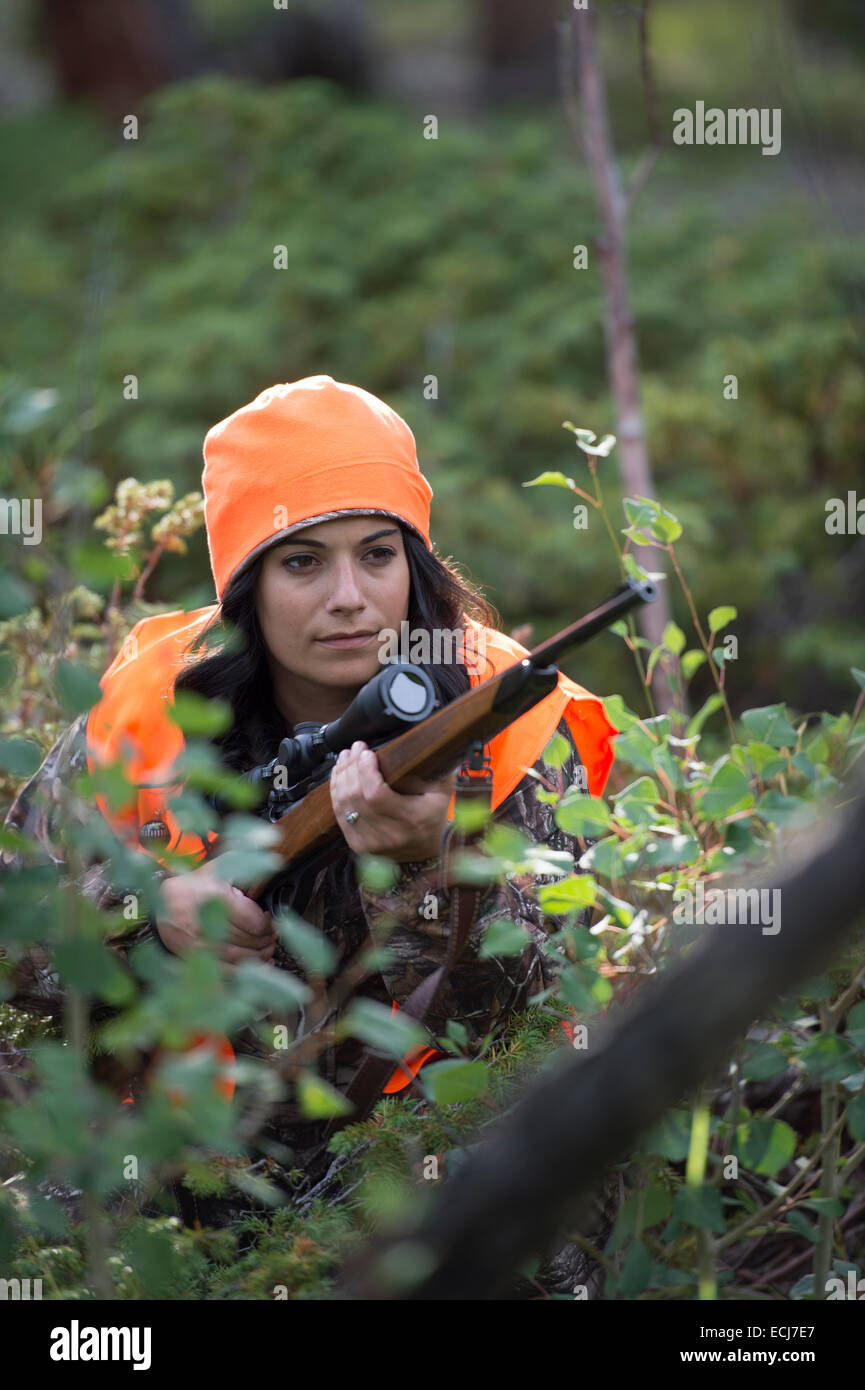 Young woman with hunting rifle hi-res stock photography and images - Alamy