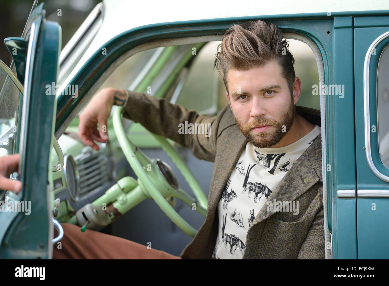 Man sitting in car Stock Photo - Alamy