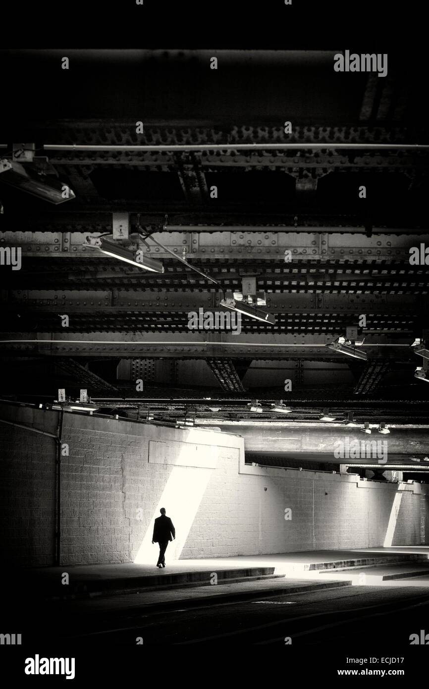 Silhouette man walking under bridge hi-res stock photography and images ...