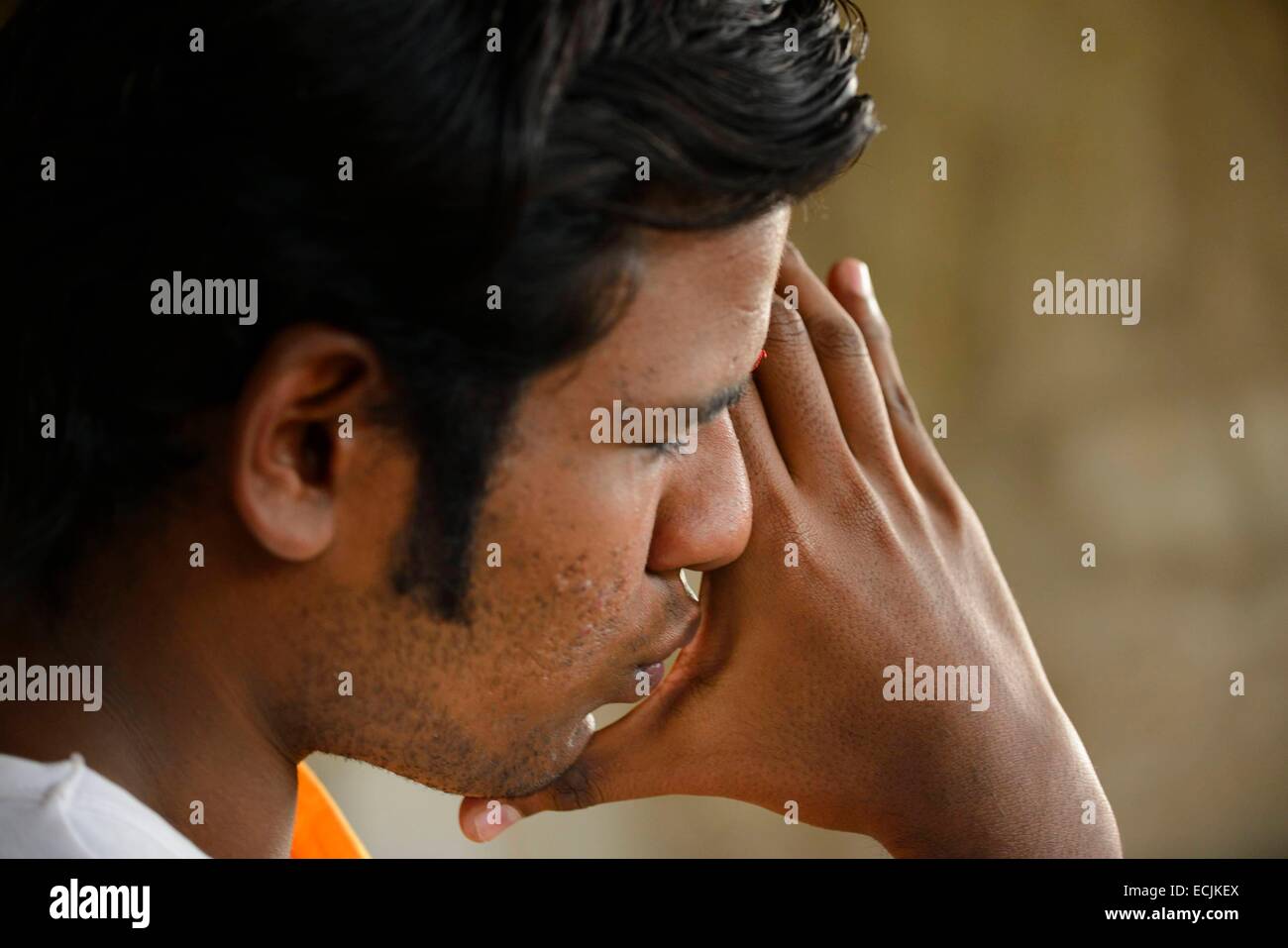 India, Rajasthan, Ranakpur, Adinath temple, Jain priest using his hand ...