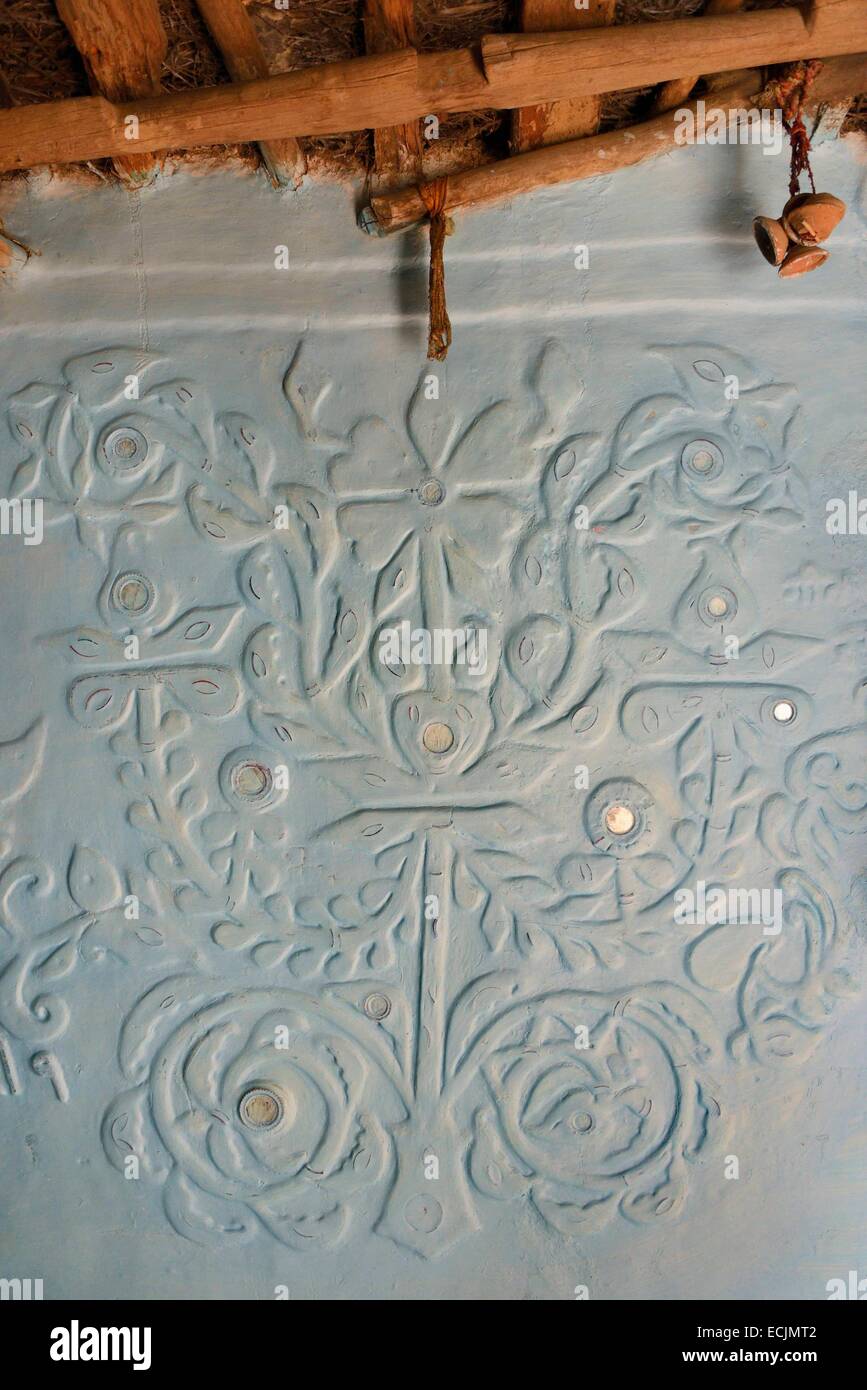 India, Rajasthan, Tonk region, Traditional Meena house with in relief ...