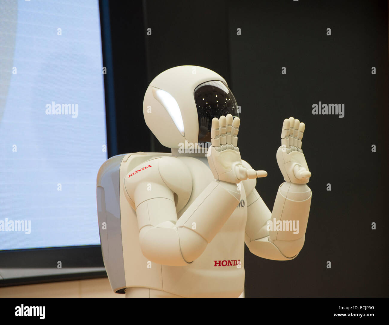 The robot Asimo performing at a meet and greet session at Honda HQ ...