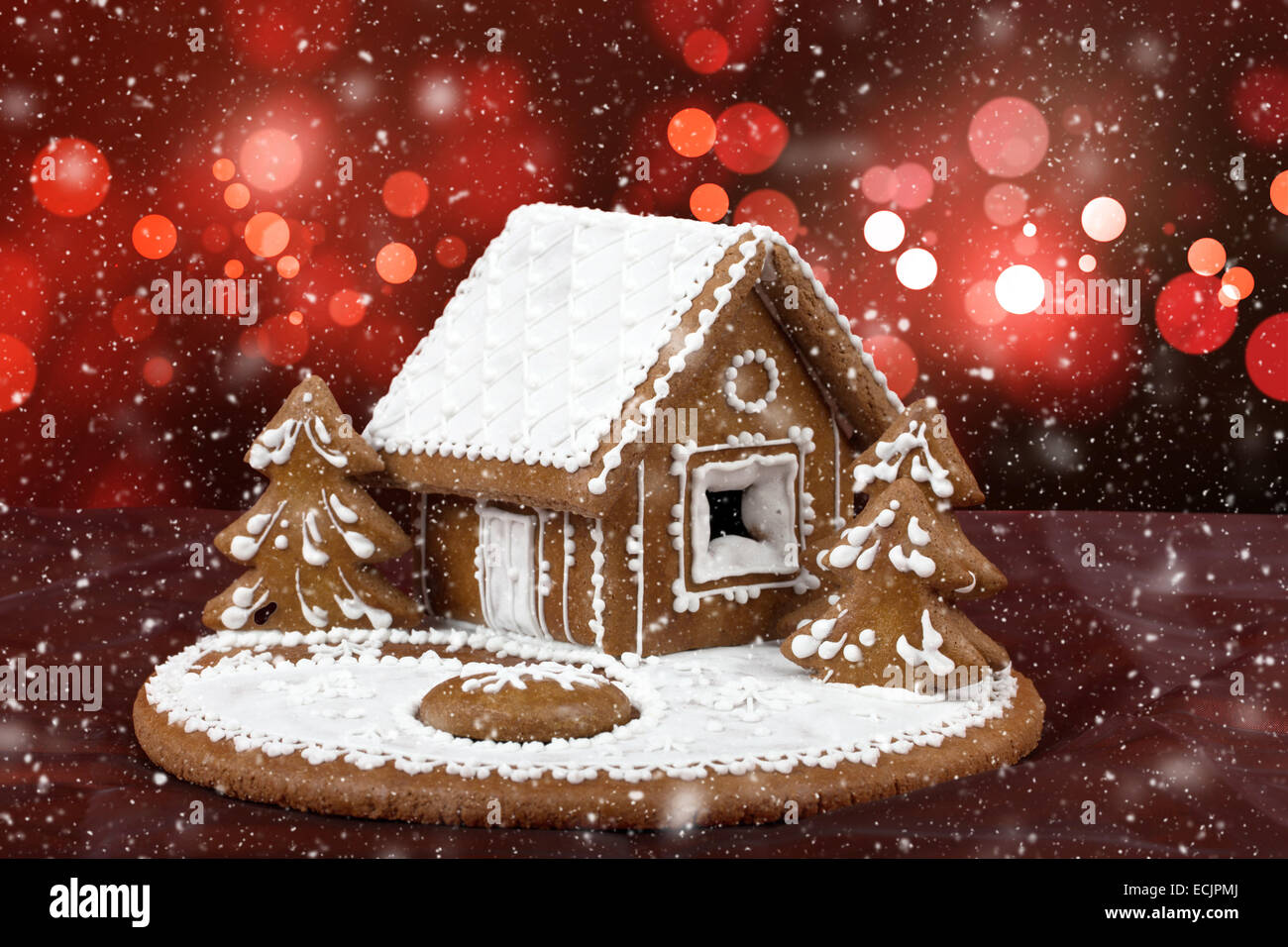 homemade holiday Gingerbread house with bokeh and snowflakes Stock ...