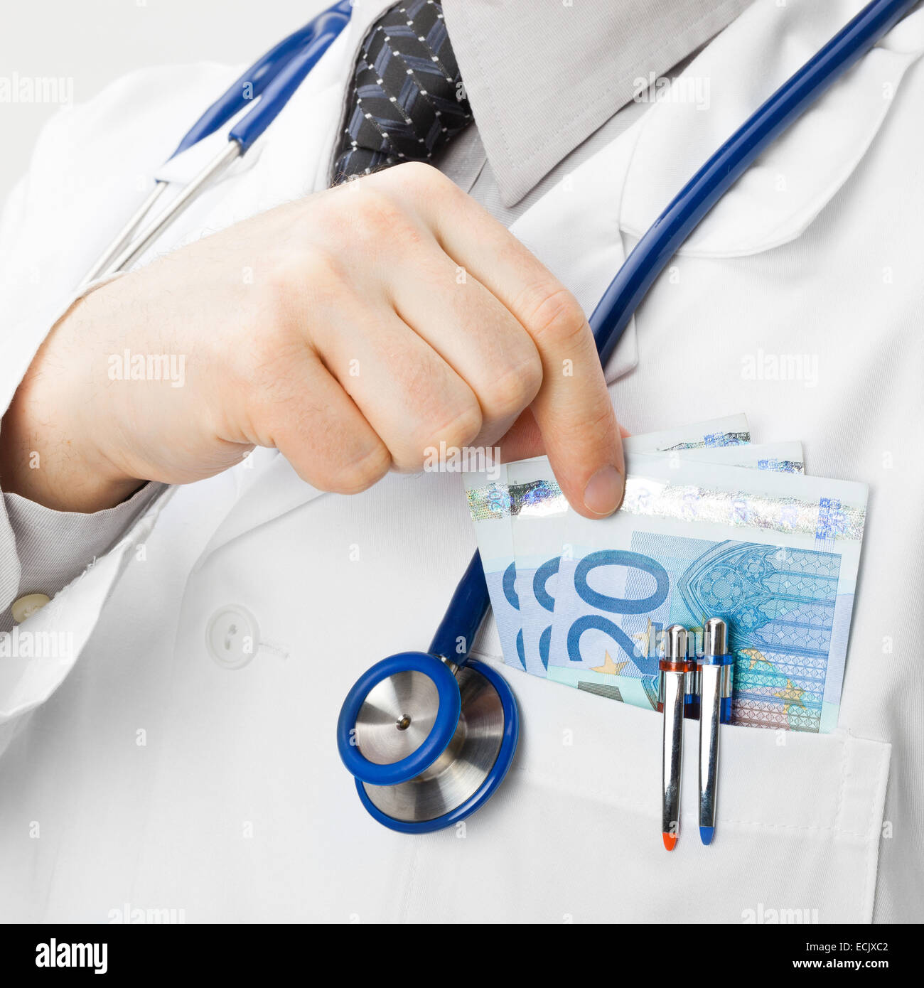 Doctor with money in his pocket - health care concept Stock Photo - Alamy