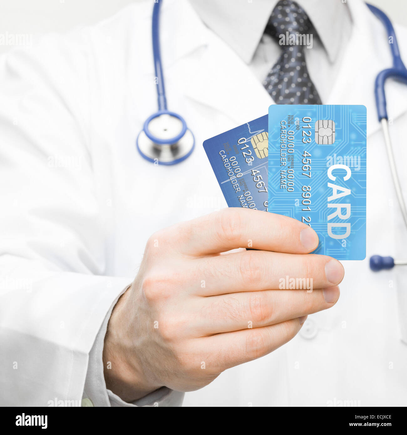 Doctor holding money credit card hi-res stock photography and images ...