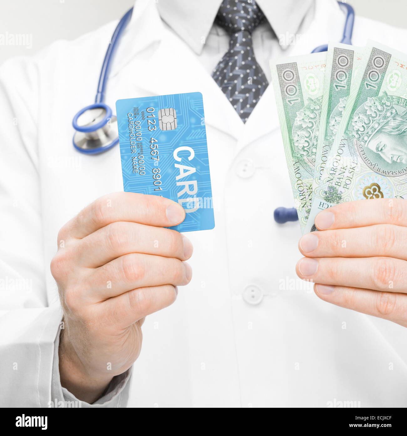 Doctor holding money credit card hi-res stock photography and images ...