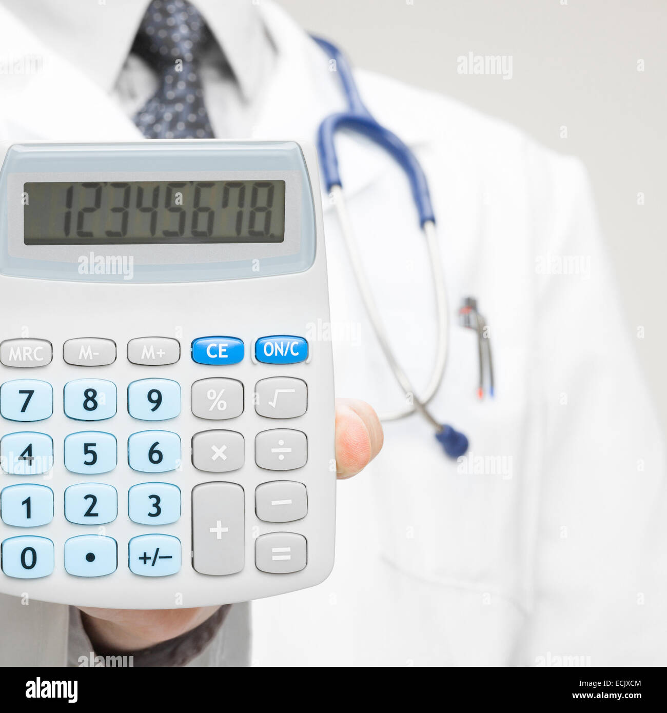 Medical doctor with calculator in his hand - health care concept Stock ...