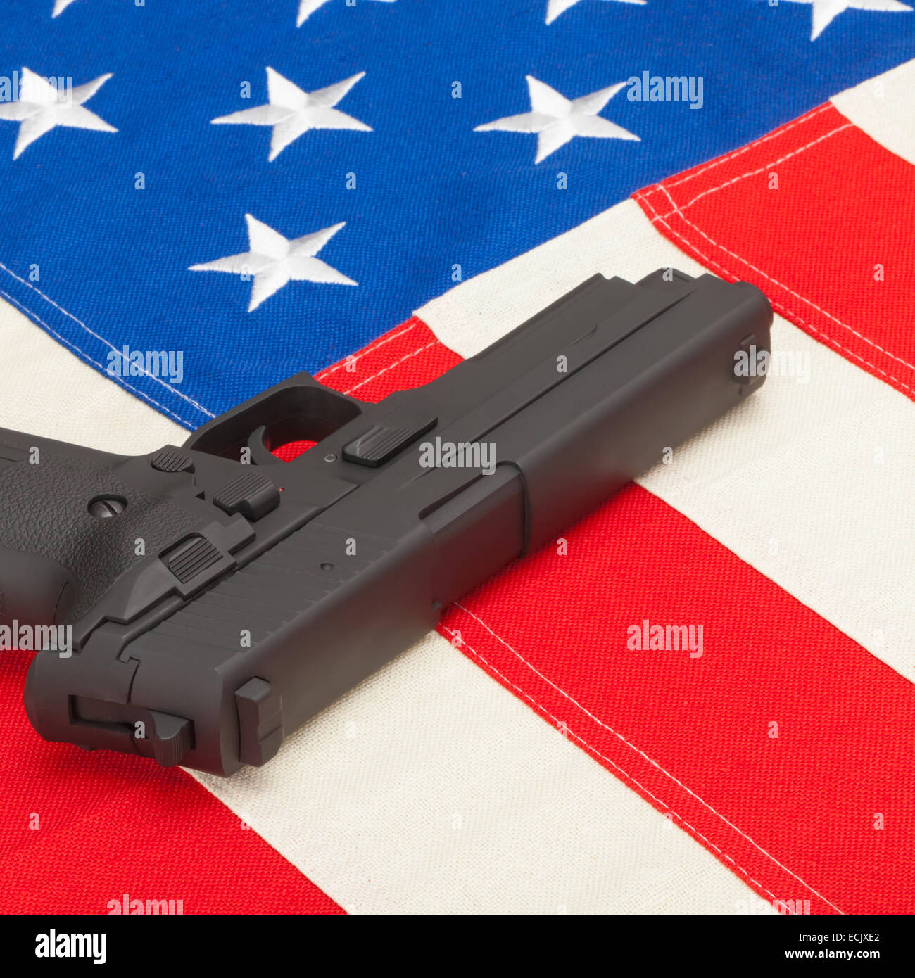 Handgun laying over USA flag - self-defense law concept Stock Photo - Alamy