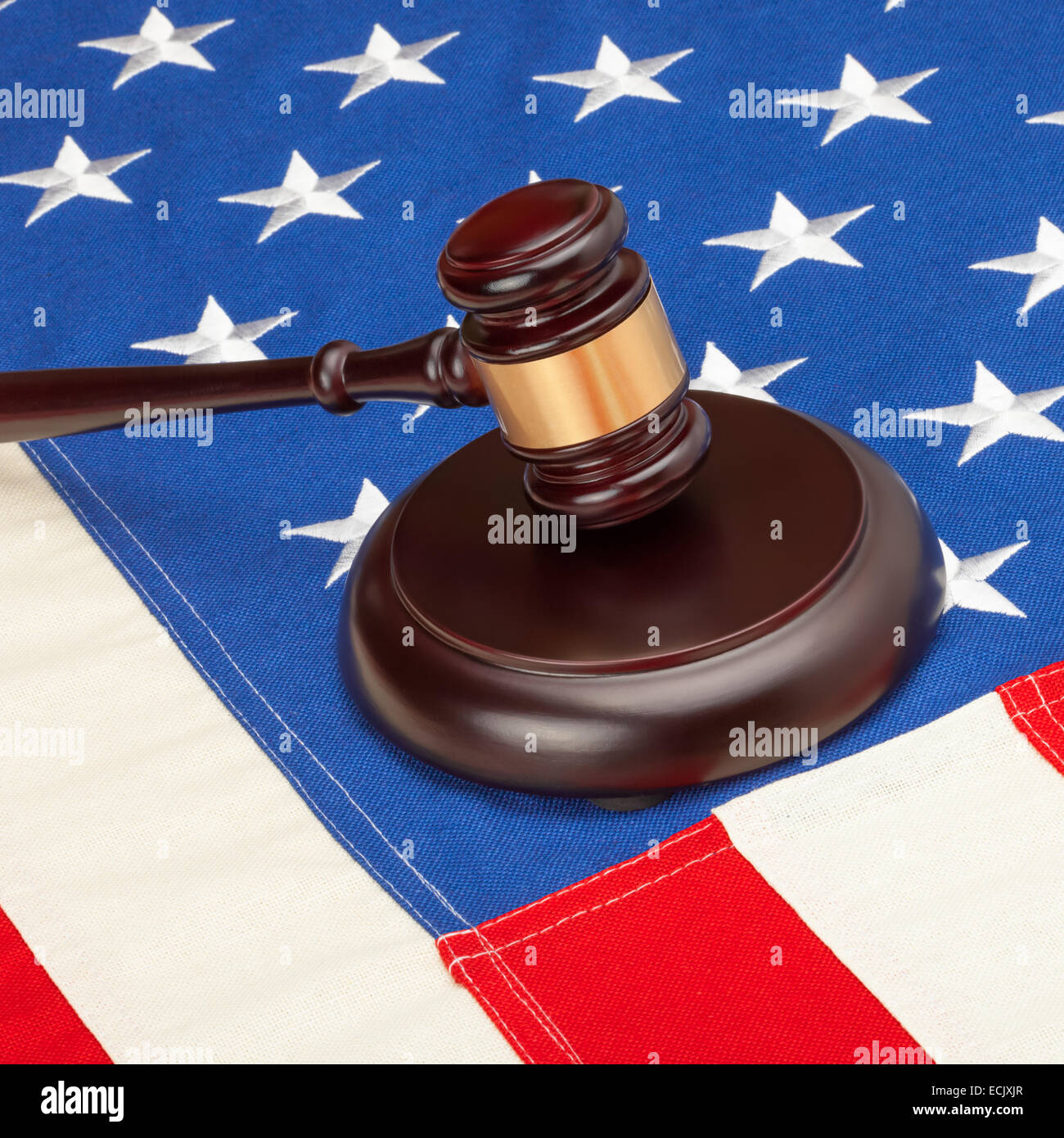 Wooden judge gavel and soundboard laying over US flag - court judgment ...
