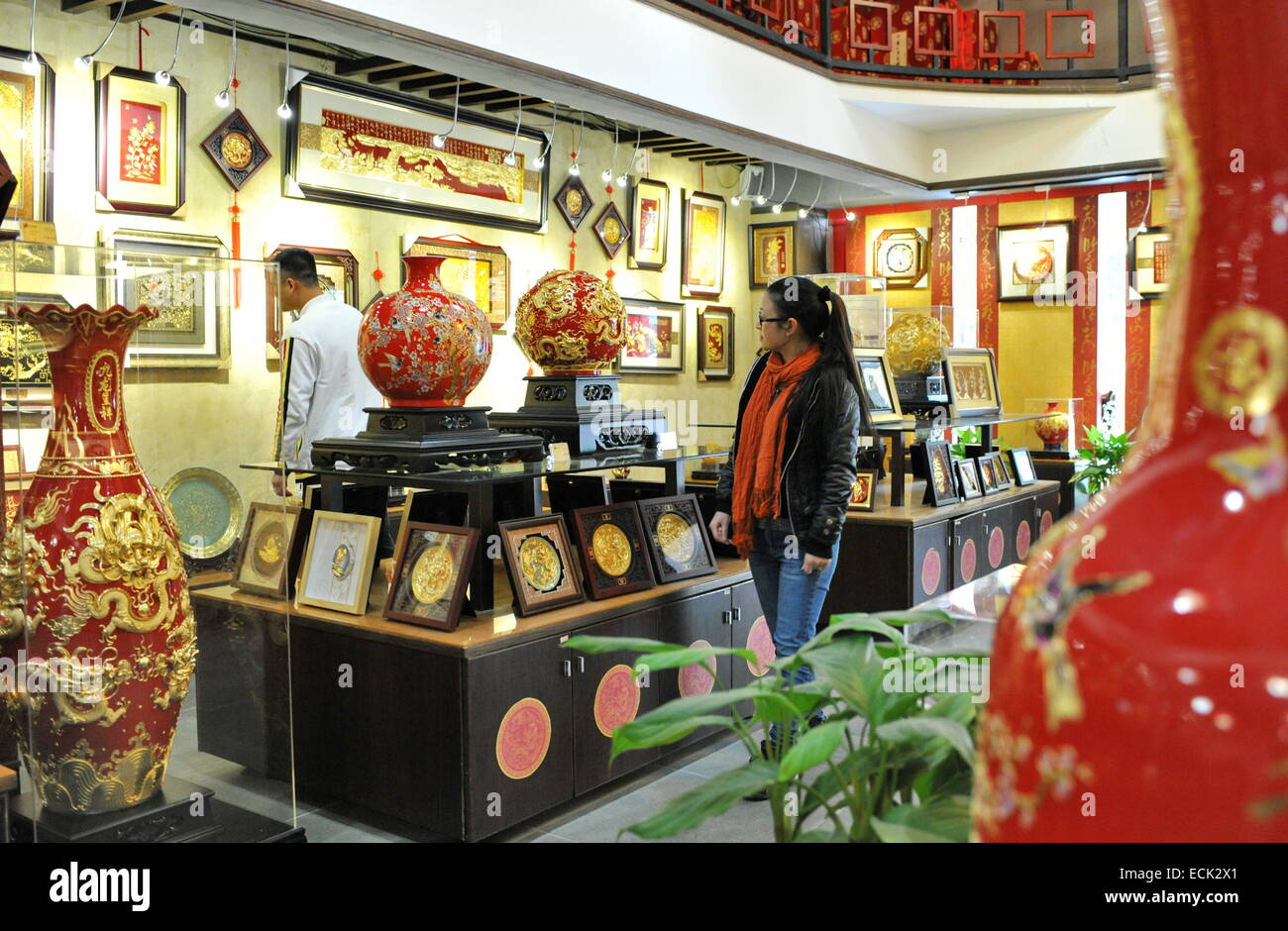 Xiamen, China's Fujian Province. 16th Dec, 2014. Customers look at ...