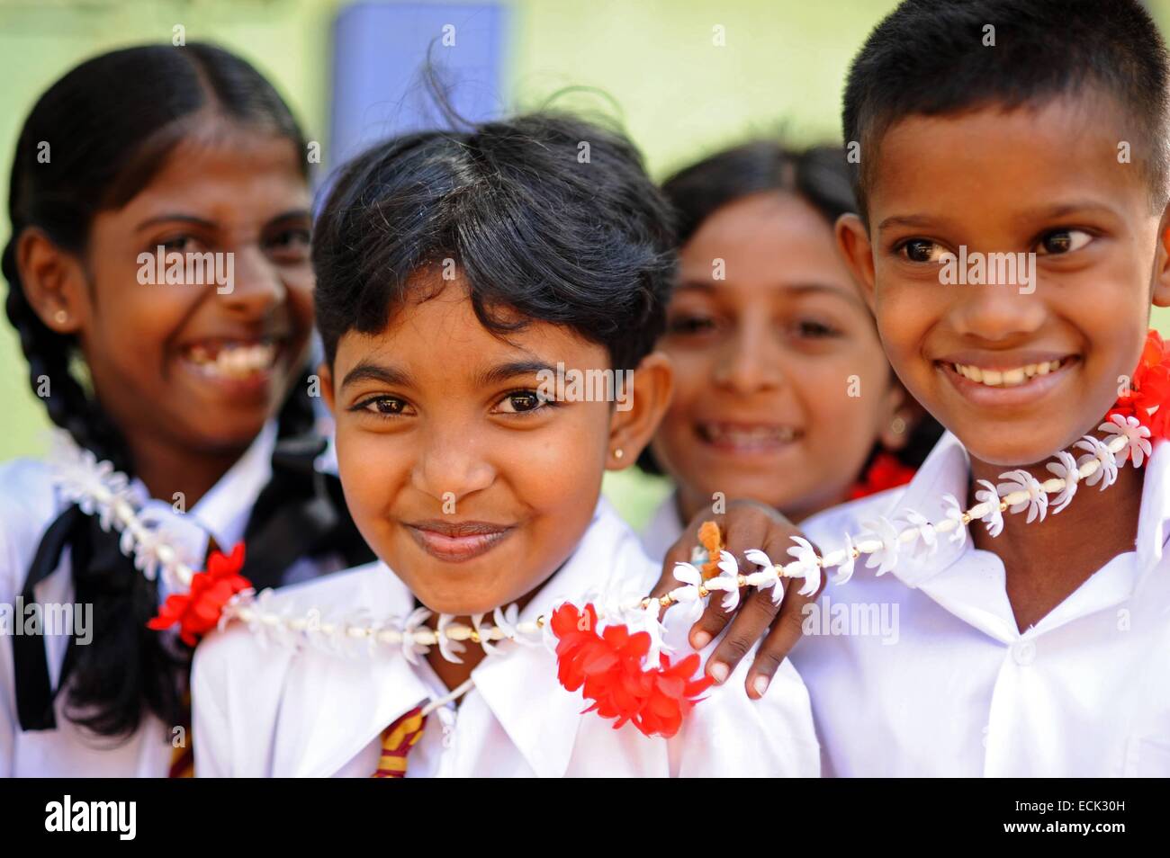 Sri Lanka, Colombo, group of children posing and smiling in front of ...