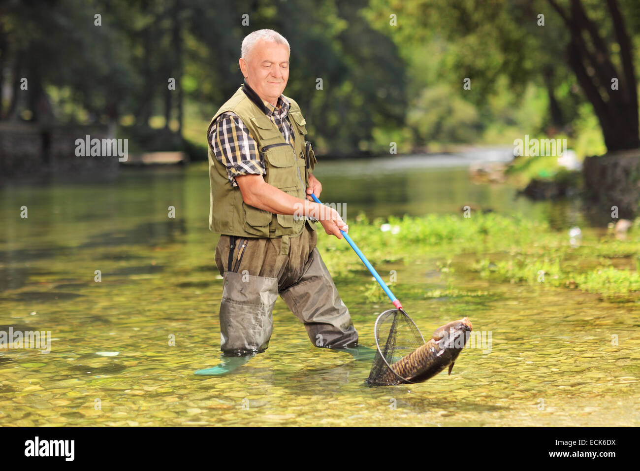 Man catching a fish hi-res stock photography and images - Alamy