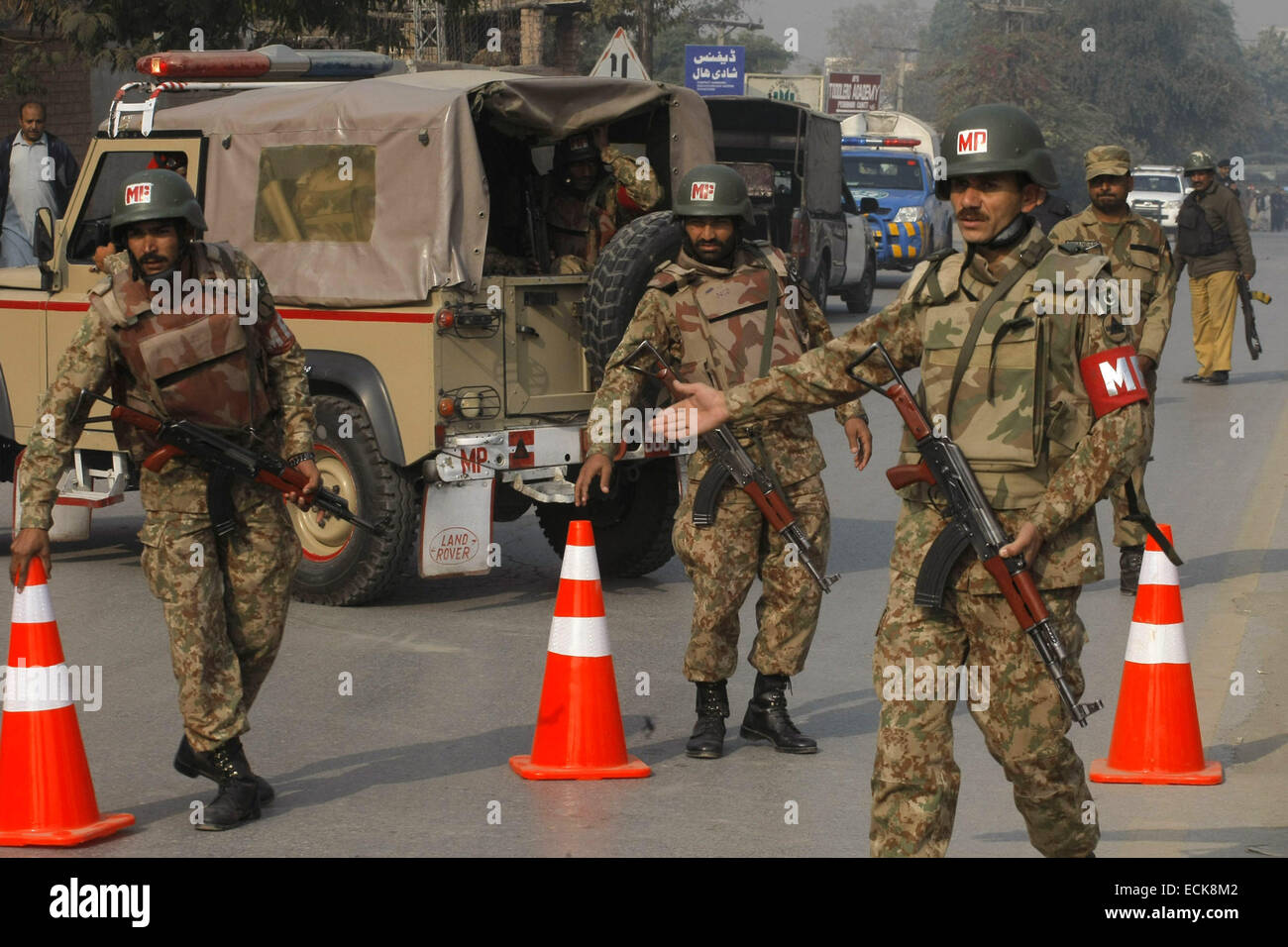 Peshawar. 16th Dec, 2014. Pakistani security forces take positions on a ...