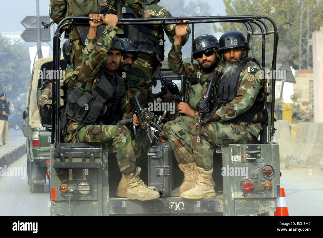 Peshawar. 16th Dec, 2014. Pakistani security forces move on a vehicle ...