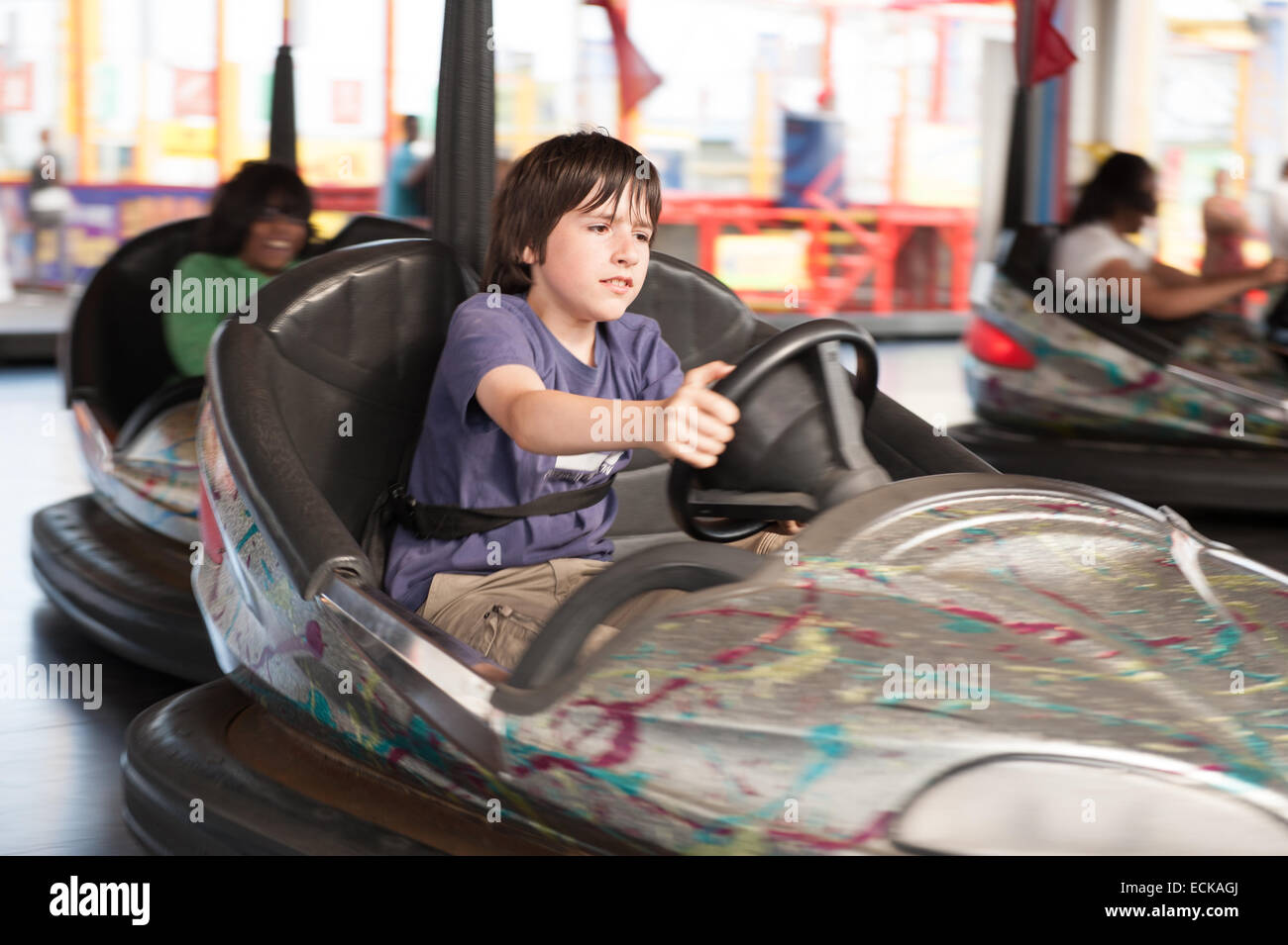 Young boy driving a dodgem on Brighton Pier Stock Photo - Alamy