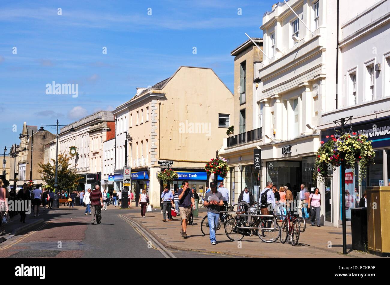 Shops with shoppers and tourists along the High Street, Cheltenham ...