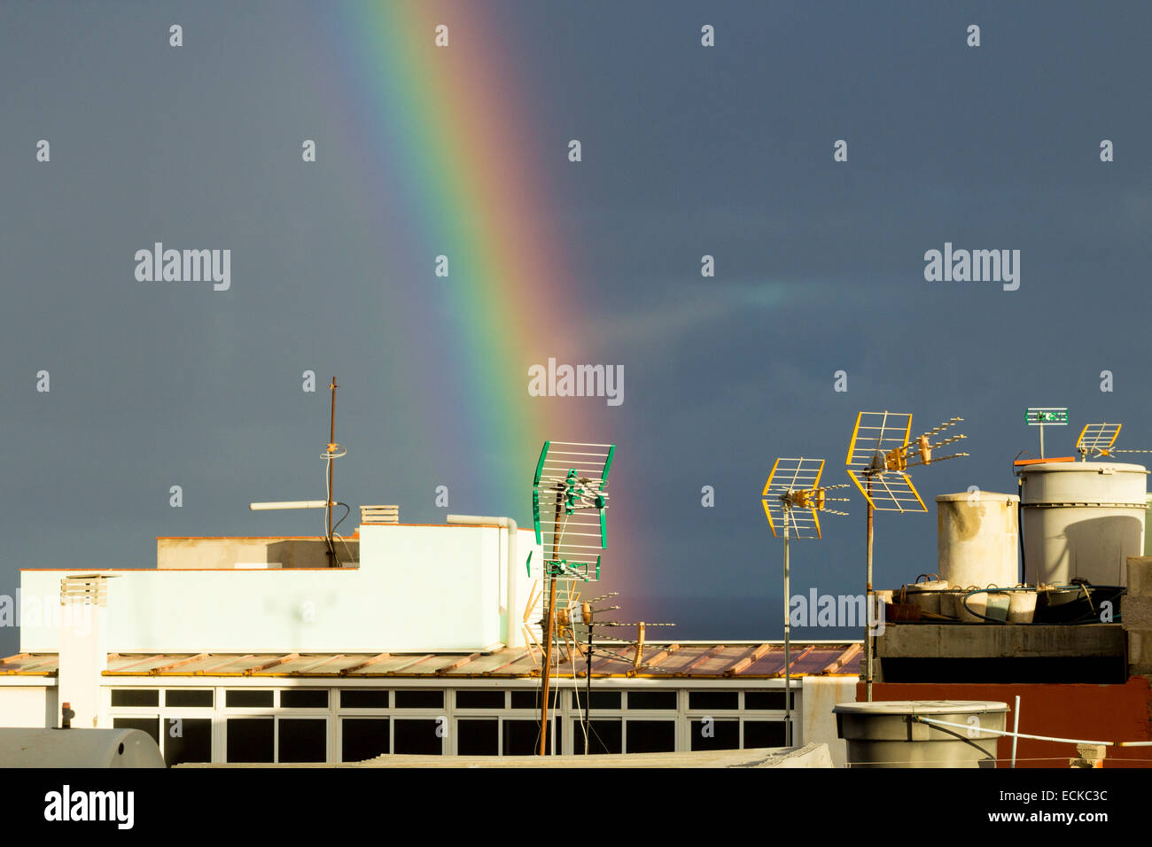 Rainbow over rooftops Stock Photo - Alamy
